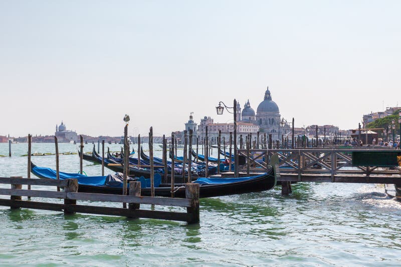 Beautiful View Of Traditional Gondola On Canal Grande With Basilica Di