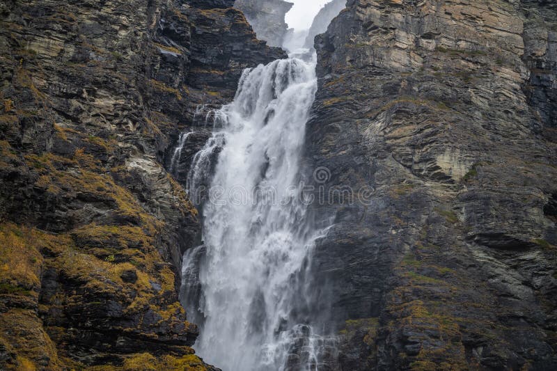 Beautiful View of a Waterfall Streaming through High Rocky Cliffs Stock ...