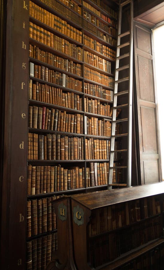 Library in a Dark Room with Antique Window Stock Photo - Image of ...
