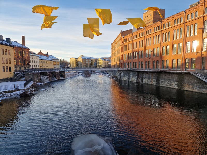 Beautiful View of Yellow Laundry on the River with Buildings Around ...
