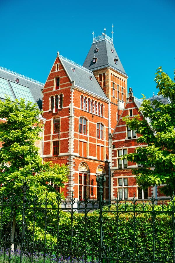 Beautiful Views of Facade of Ancient Building among Trees. of Amsterdam ...