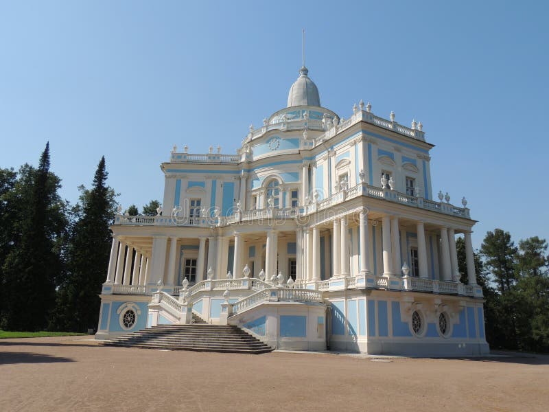 Beautiful Vintage Blue and White Building with Columns and Staircase ...