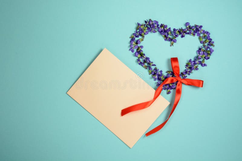 Beautiful Violets in Heart Form on Light Blue Background Stock Photo ...