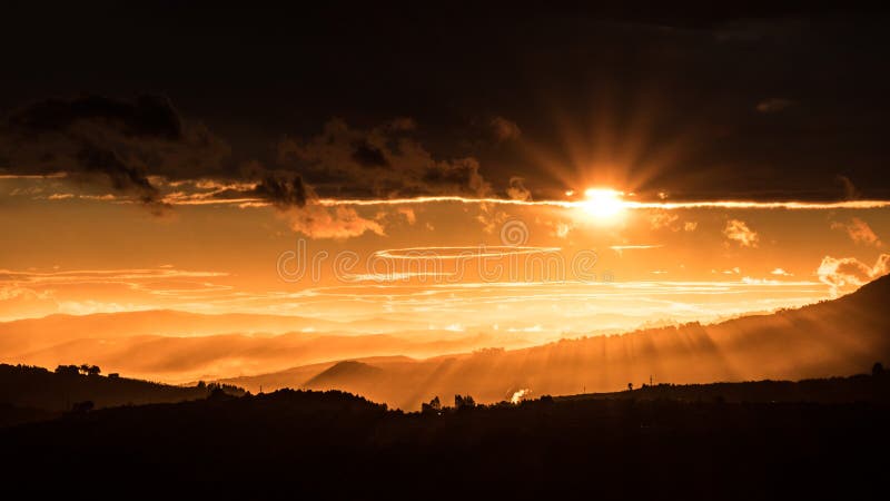 Beautiful Warm and Orange Sunset and Sunrays Stock Photo - Image of ...