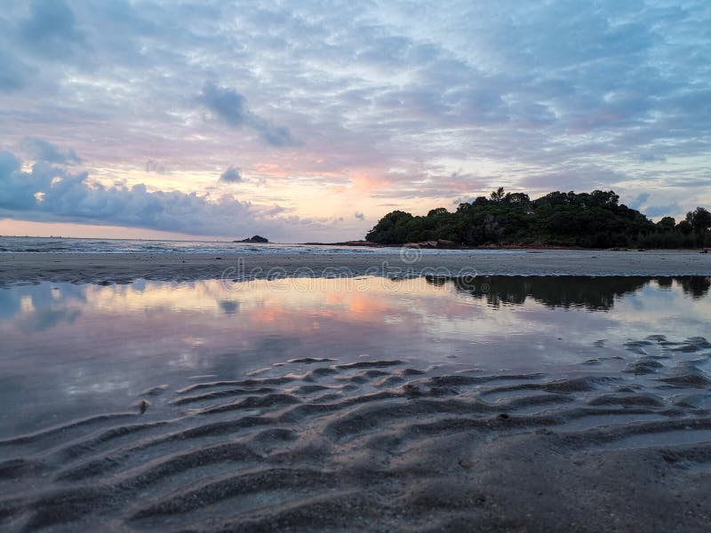 Beautiful Water Reflection and Pattern on Low Tide Beach during Sunrise ...