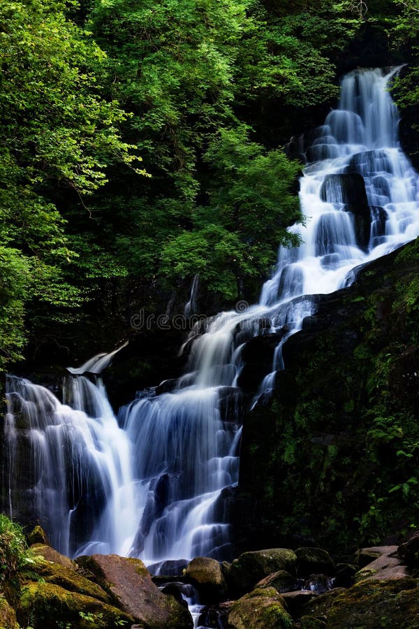Stunning Waterfall Flowing Over Rocks in Forest Stock Image - Image of ...