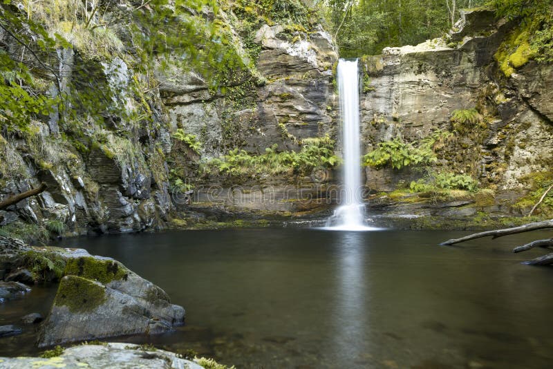 Beautiful Waterfall Falling Over a Pool of Crystal Clear Water in O ...