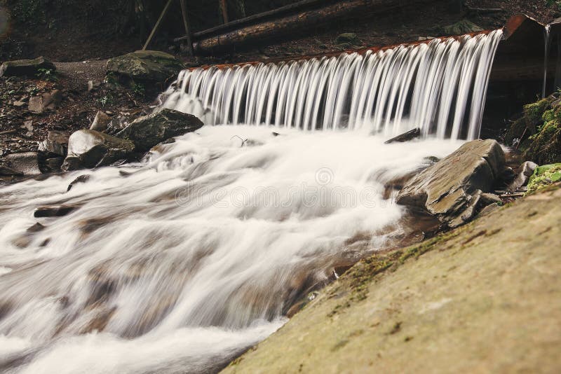 Beautiful Waterfall in Forest in Mountains with Flowing Motion Water ...