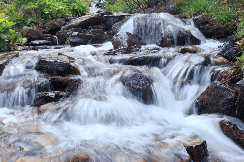 Beautiful Waterfall in the Mountains during the Summer. Stock Photo ...
