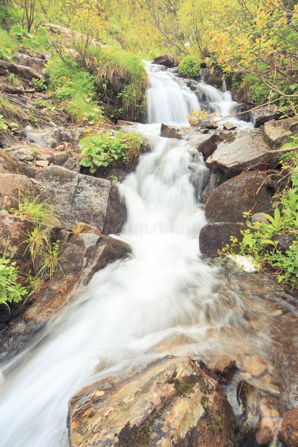 Beautiful Waterfall in the Mountains during the Summer. Stock Photo ...