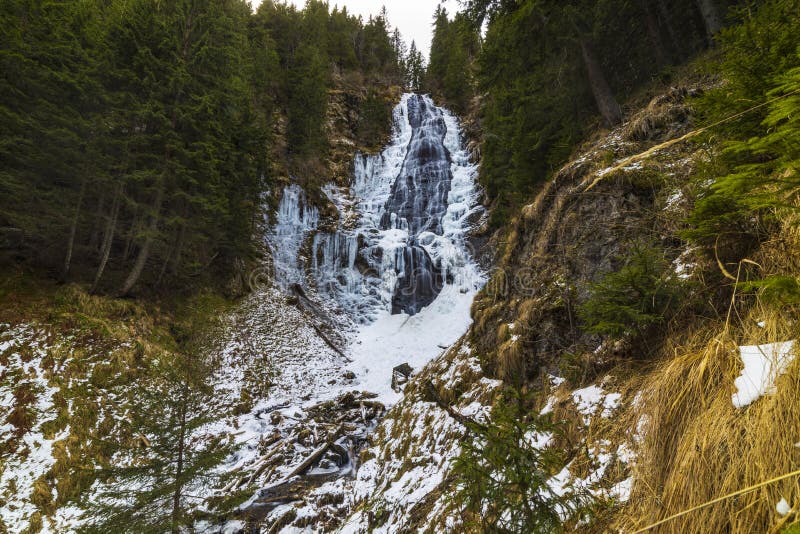 A Beautiful Waterfall in the Mountains during Winter Day Stock Image ...