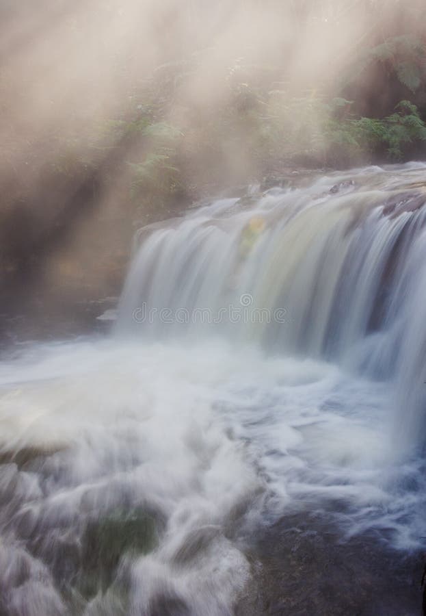Beautiful Waterfall in Rays of Sunshine Stock Photo - Image of rain ...