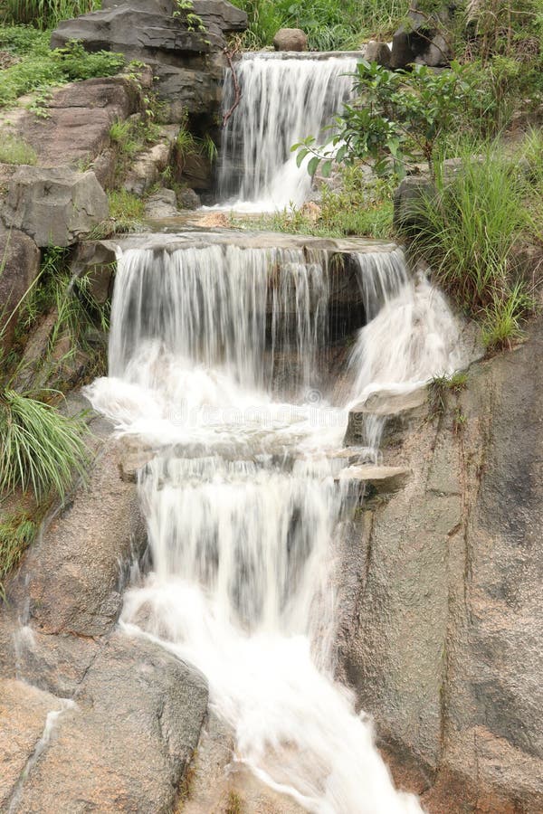 Waterfall Running Down the Mountain and into the Fjord in the Spring ...
