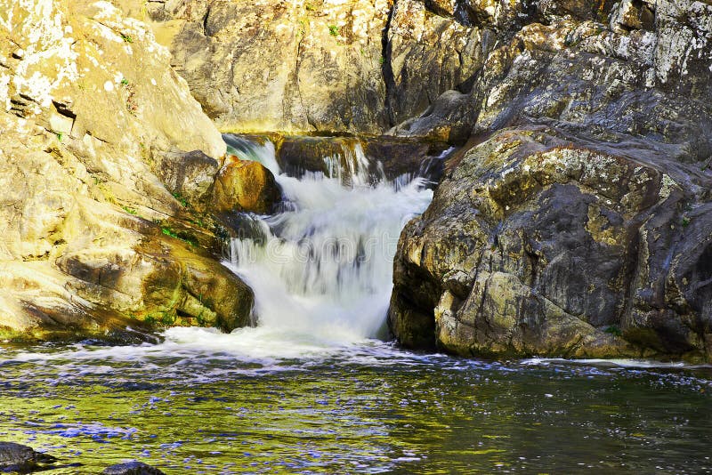 Beautiful Waterfall Over Rocks Stock Photo - Image of motion, flowing ...