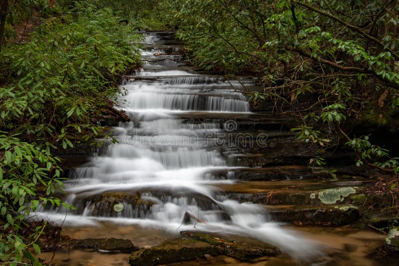 A Beautiful Waterfall in the Woods Stock Image - Image of beautiful ...