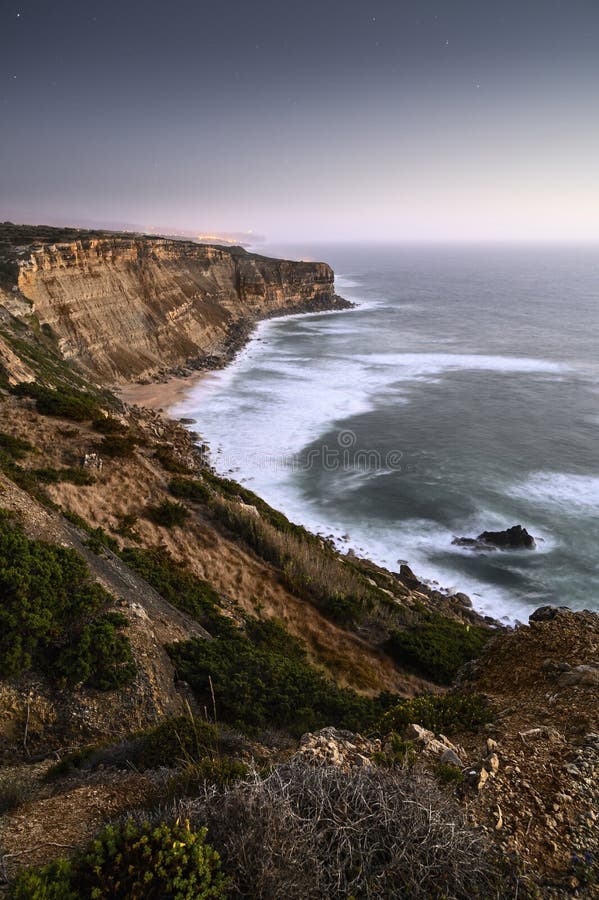 Beautiful Wavy Ocean Hitting the Beach Surrounded by High Cliffs Stock ...