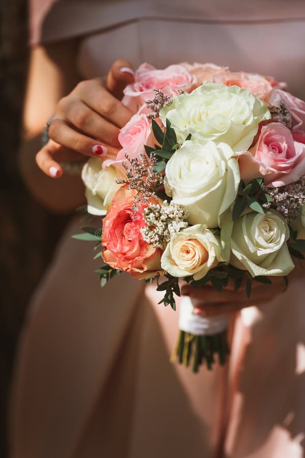 Beautiful Wedding Bouquet of Cream Roses in Hands of the Bride Stock ...