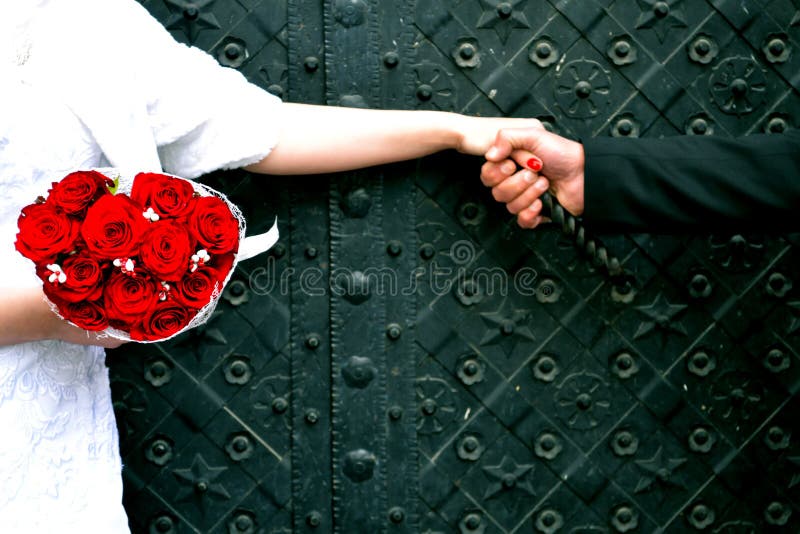 Beautiful Wedding Bouquet of Red Roses in the Hands of the Bride Stock ...