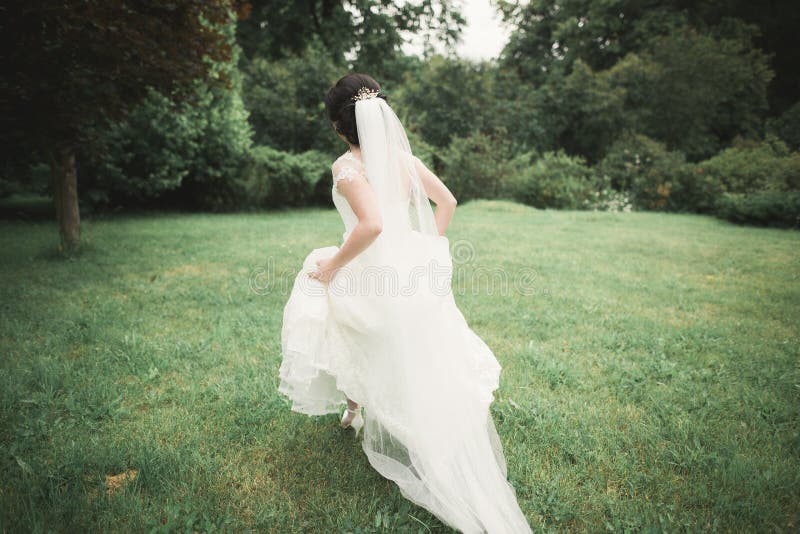 Beautiful Wedding Bride Running In The Garden Stock Image - Image of ...