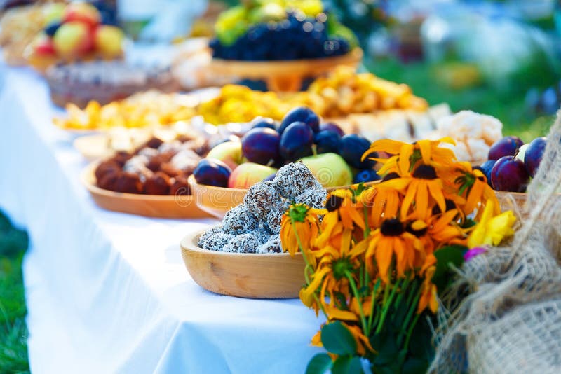 Beautiful Wedding Feast in Nature, Abundance of Meals on a Table. Stock ...