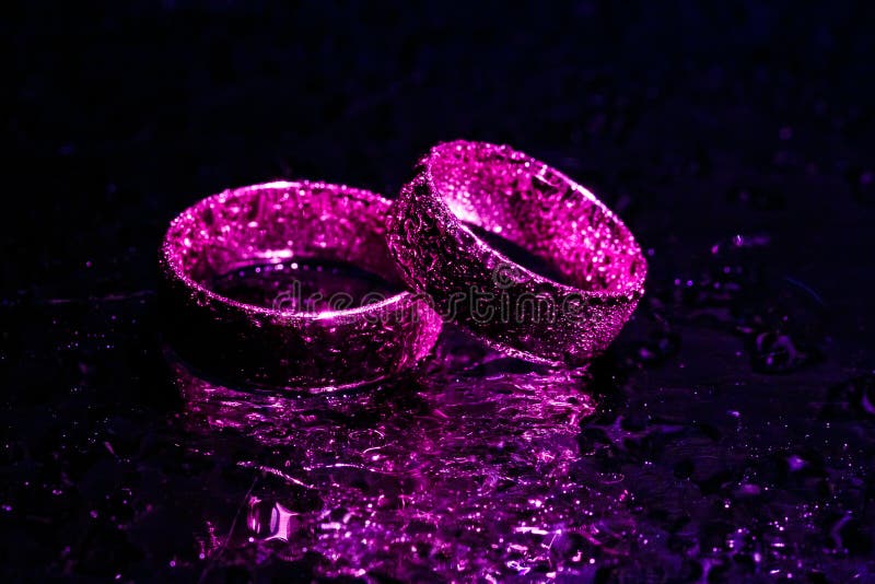 Beautiful Wedding Rings with Violet Neon Lights Stock Photo - Image of ...