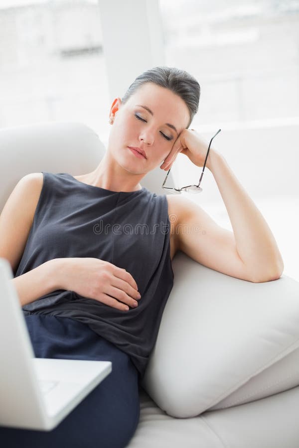 Beautiful Well Dressed Woman Resting on Sofa while Using Laptop Stock ...