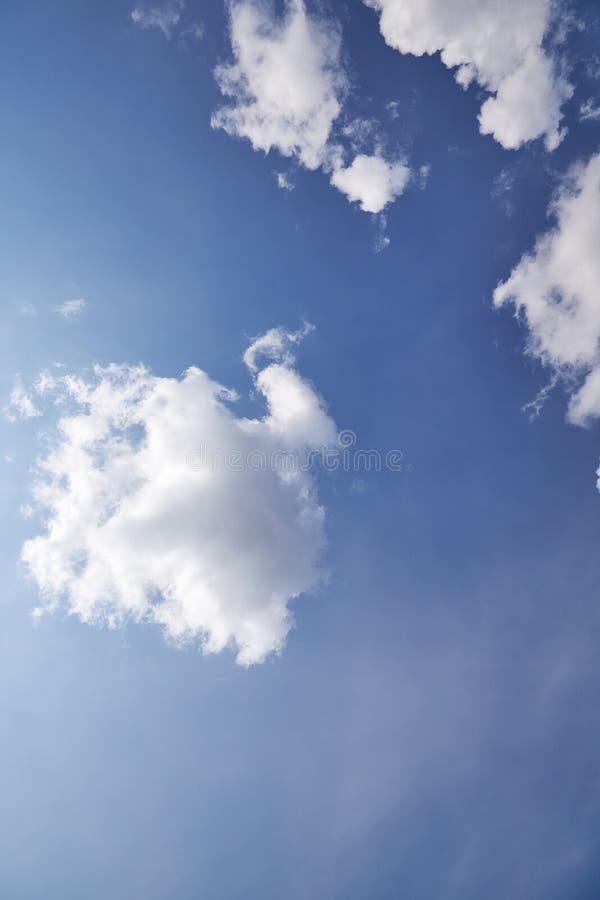Beautiful Whimsical Clouds Against the Blue Daytime Sky.Vertical Frame ...