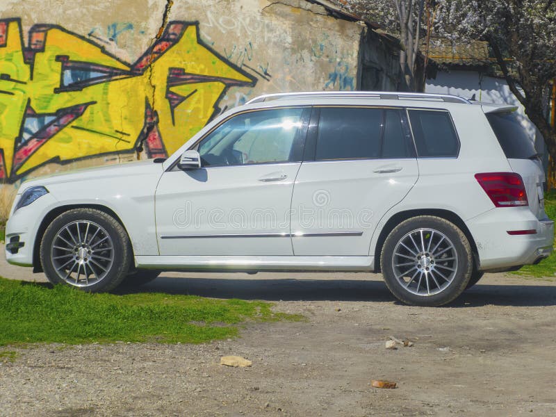 Beautiful White Car Near Multi-colored Wall Stock Image - Image of ...