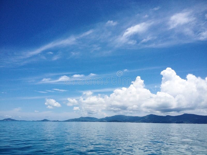 Beautiful White Clouds on Blue Sky Over Calm Sea Stock Image - Image of ...