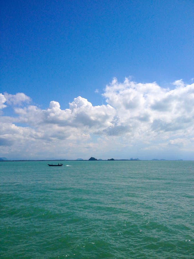 Beautiful White Clouds on Blue Sky Over Calm Sea Stock Photo - Image of ...