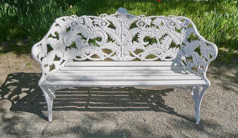 Beautiful White Iron Bench in a Spring Park on a Background of Grass in ...