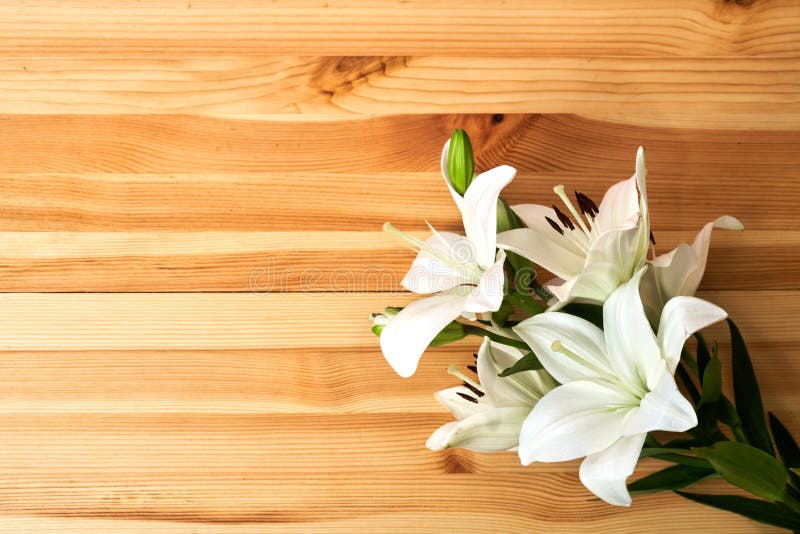 Beautiful White Lilies on a Wooden Table. View from Above Stock Image ...
