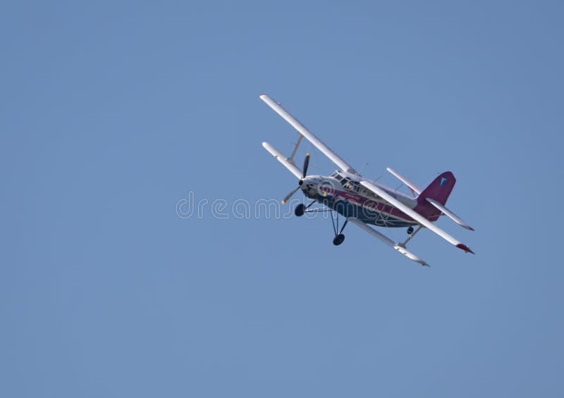 A Beautiful White Plane Flies Against a Blue Sky Editorial Photography ...
