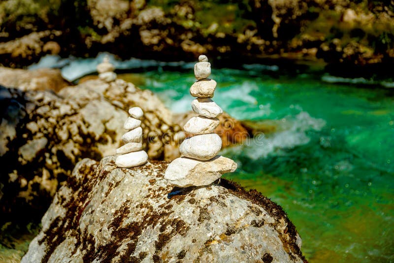 Beautiful Wild River with Turquoise Water and Stack of Stone Piles ...