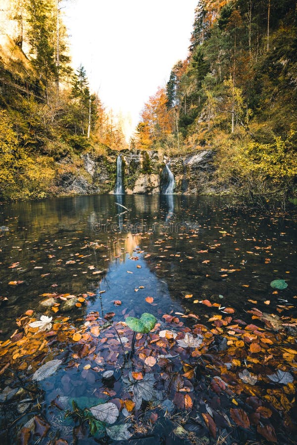 A Beautiful Wild Waterfall Flowing into a Pool during Autumn Stock ...