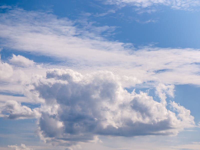 A Beautiful Wind-torn Cloud Slowly Loses Its Shape at the Edges in the ...
