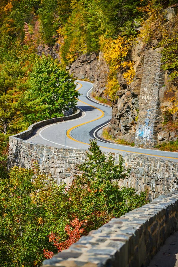 Beautiful Winding Road with Stone Wall Along Cliff Edge in Mountains ...