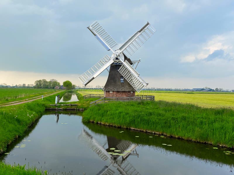 Windmill the Netherlands stock image. Image of clouds - 257737441