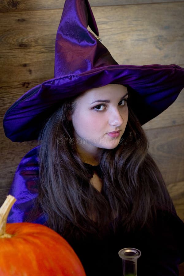 Beautiful Witch in Purple Halloween with a Broom Stock Photo - Image of ...