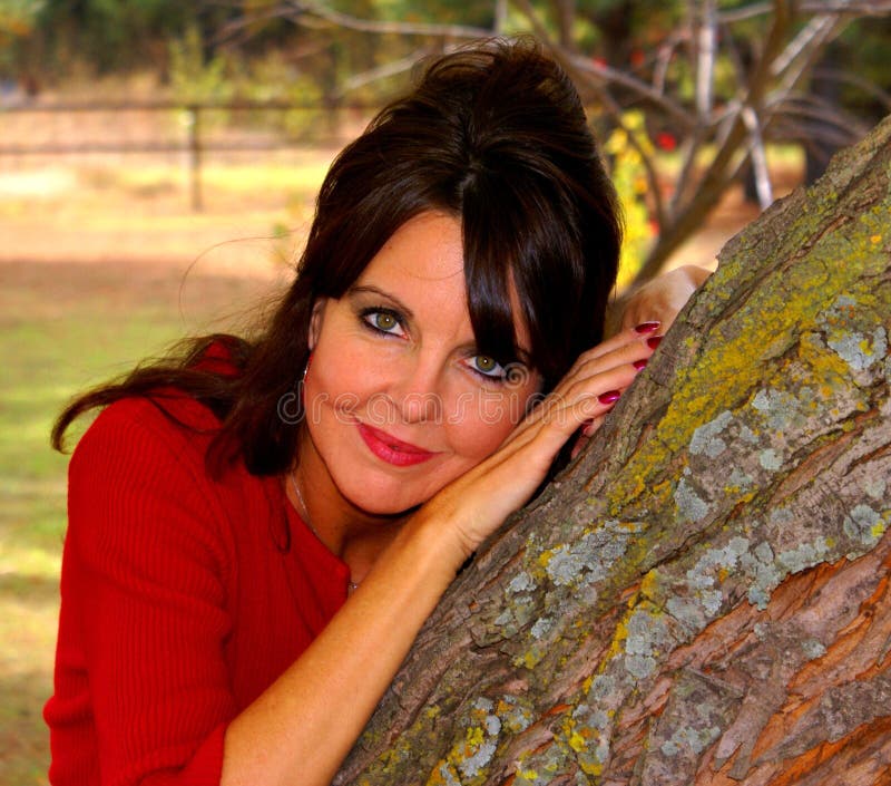 Beautiful Woman Against Tree Stock Image - Image of tree, green: 11642905