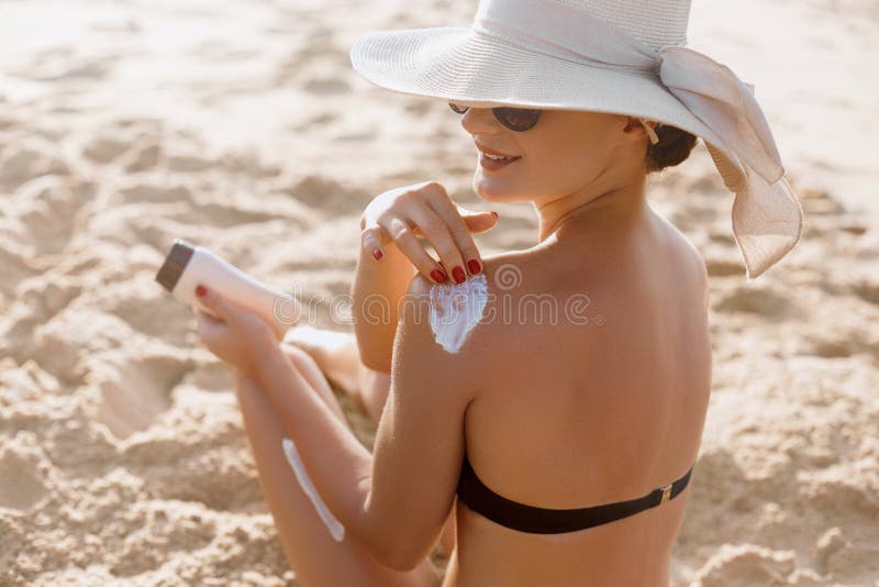 Beautiful Woman Apply Sun Cream On Tanned Back Skin And Body Care Sun