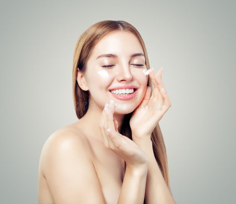 Beautiful Woman Applying Cream On Her Clean Healthy Skin Female Face