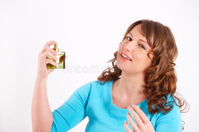 Woman Applying Perfume on Wrist Stock Image - Image of friendly, blond ...