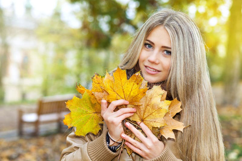 Beautiful woman in autumn stock image. Image of cheerful - 27778547