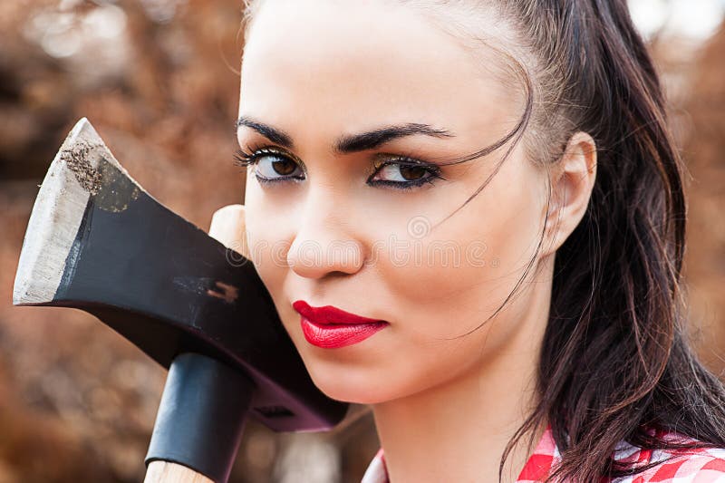 Beautiful woman with an ax stock image. Image of lipstick - 47154989