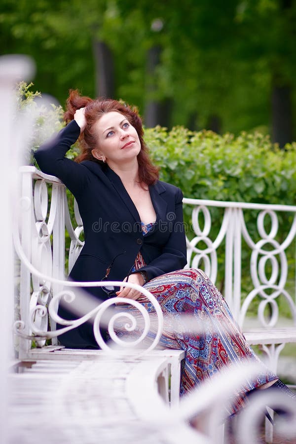 The Beautiful Woman on a Bench Stock Image - Image of happiness ...