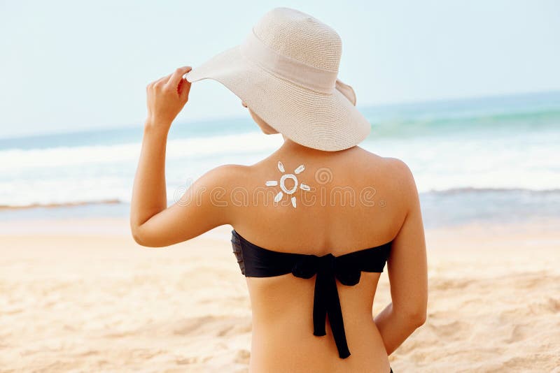 Beautiful Woman In Bikini Applying Sun Cream On Tanned Shoulder Sun