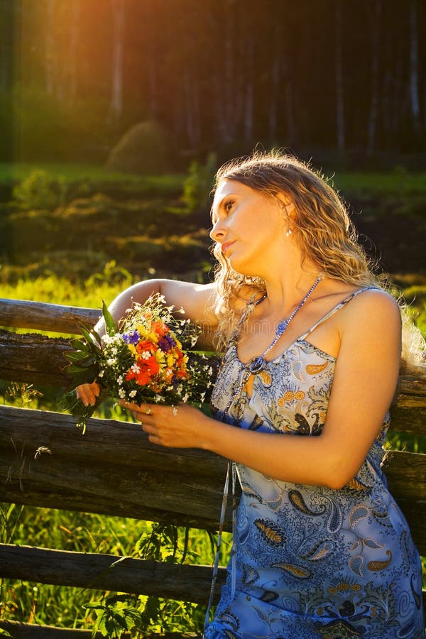 Beautiful Woman with a Bunch of Flowers. Stock Image - Image of elegant ...