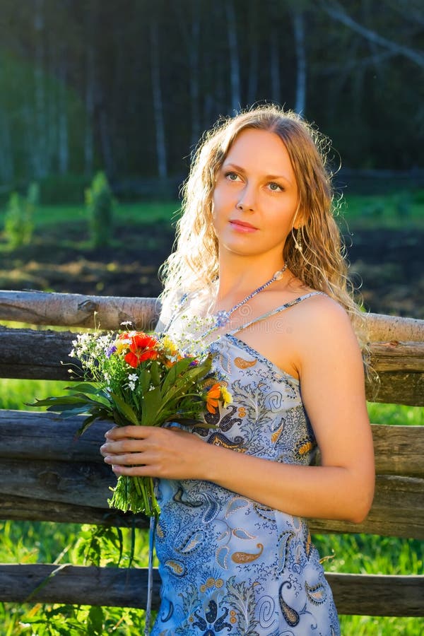 Beautiful Woman with a Bunch of Flowers. Stock Photo - Image of forest ...