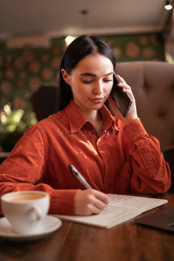 Beautiful Woman in Cafe, Drinking Coffee, Writing in Notebook, Checking ...